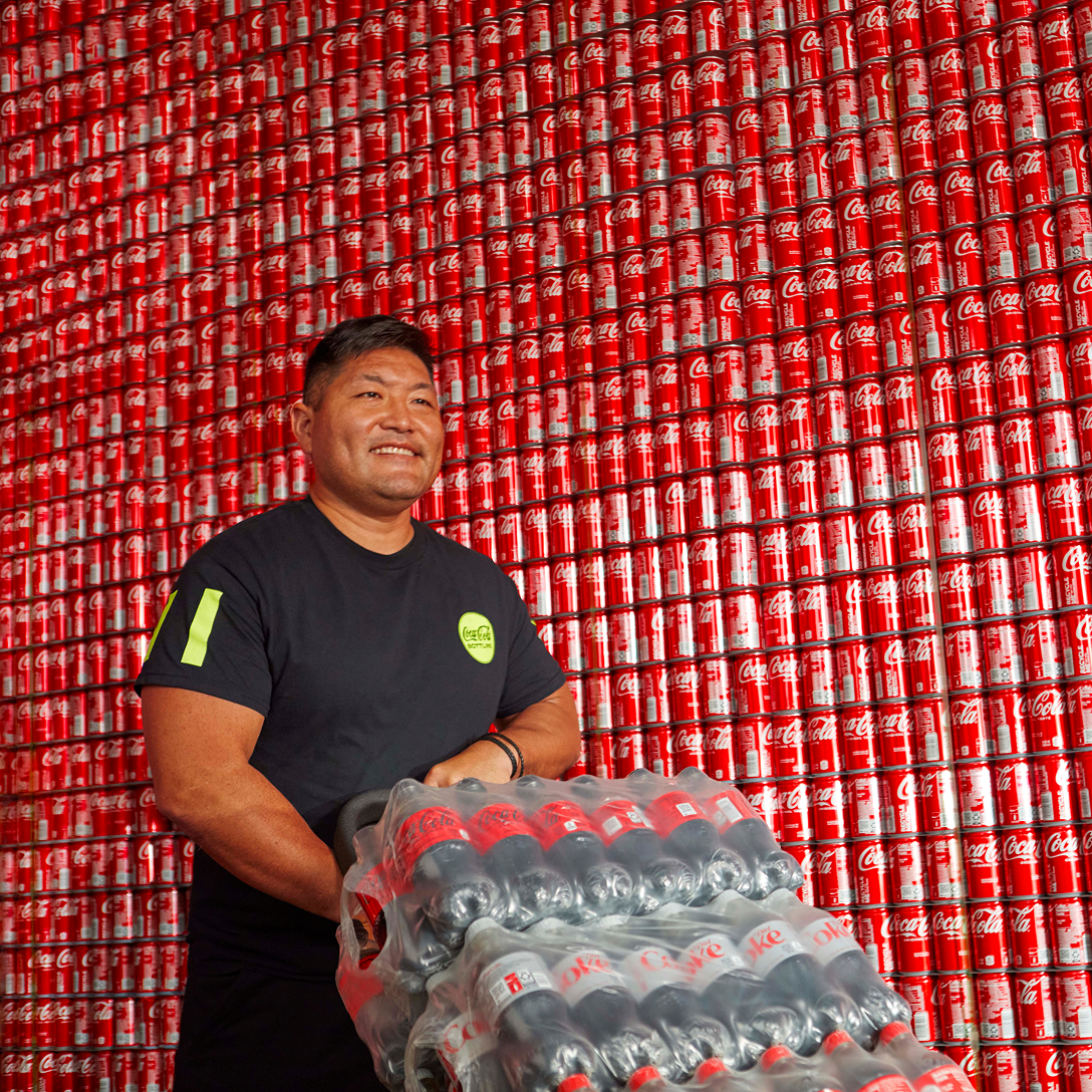 Man delivering coke products